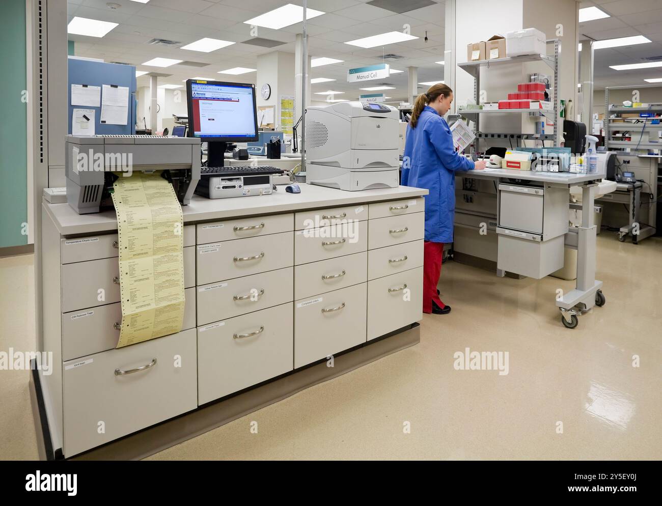 Hospital lab with woman working Stock Photo - Alamy