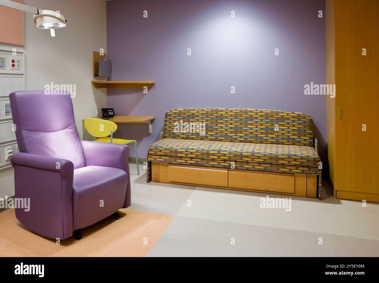 Hospital bed folds back to couch with colorful upholstery hi-res stock ...