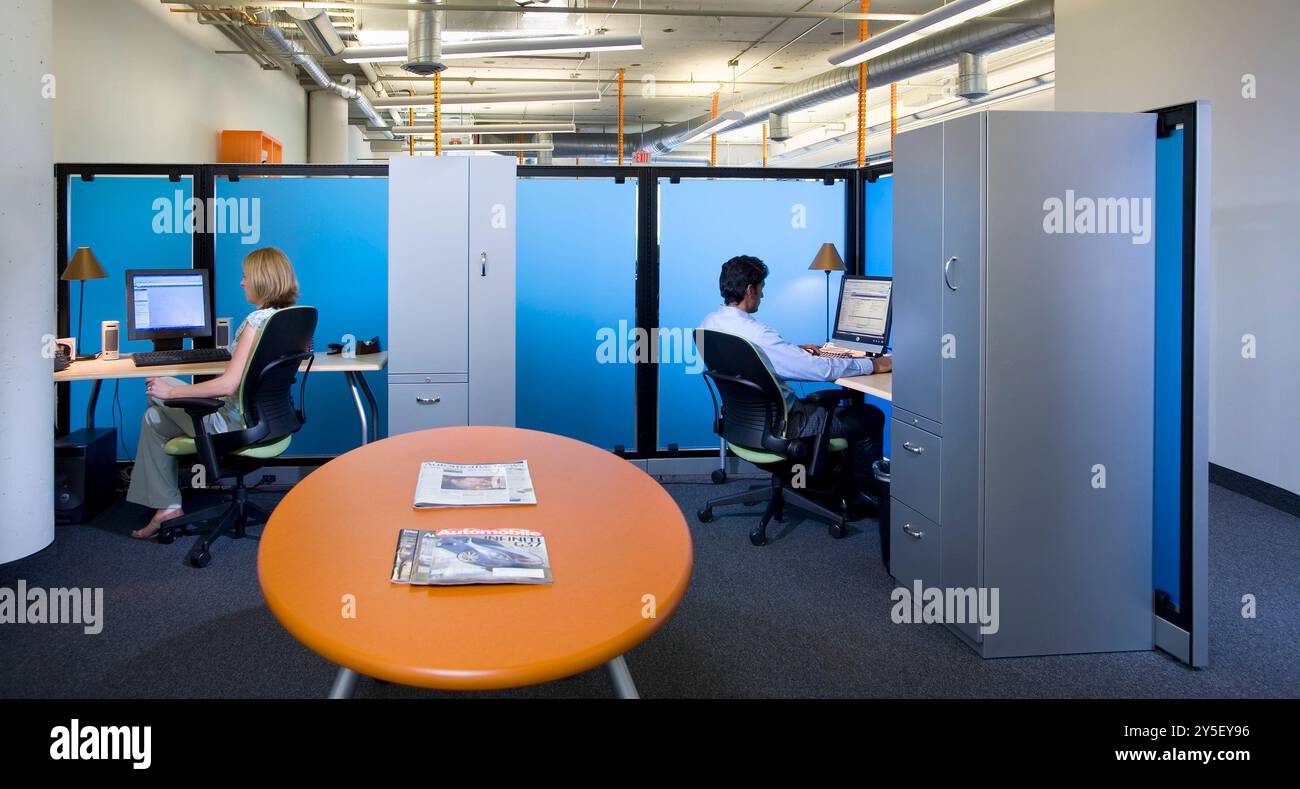 Office space with two people and blue translucent walls Stock Photo - Alamy