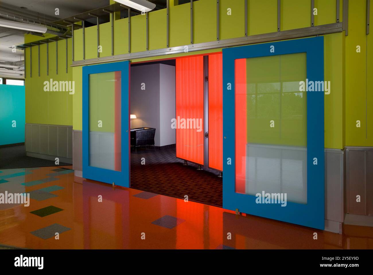 Colorful hallway of office space showing entrance to employee lounge ...
