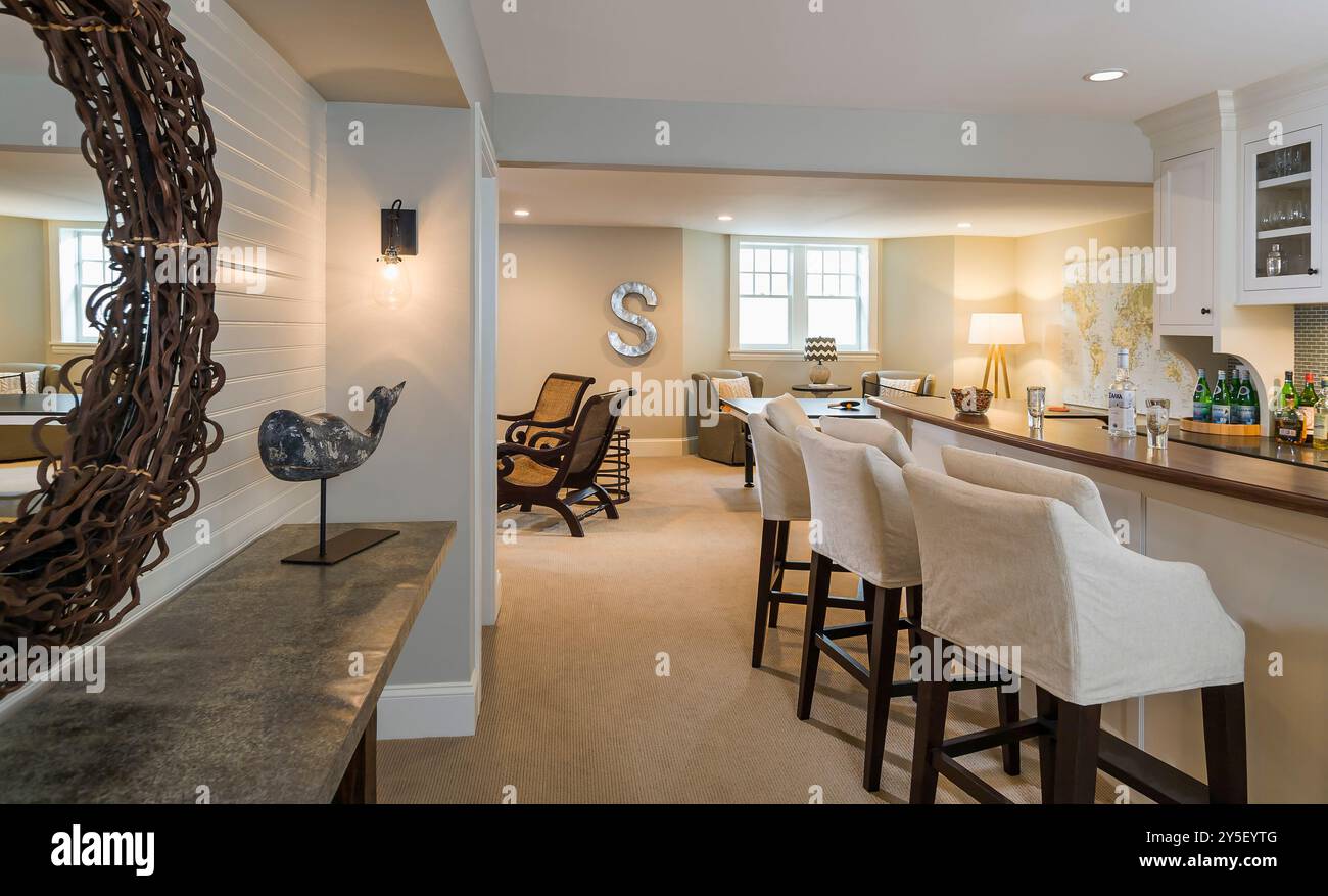 Basement level of house with family gathering area and bar Stock Photo ...