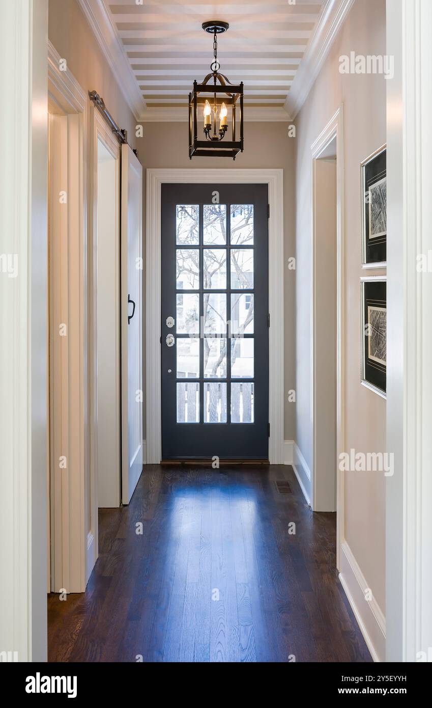 Interesting hallway in house with wrought iron colonial light fixture ...