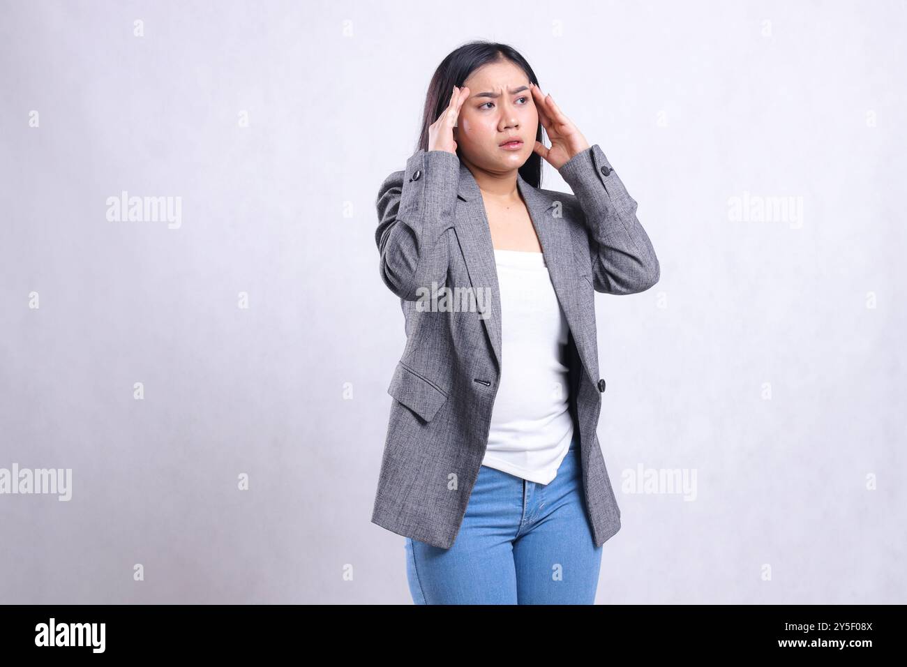 expression of beautiful adult office woman dizzy both hands hold head ...