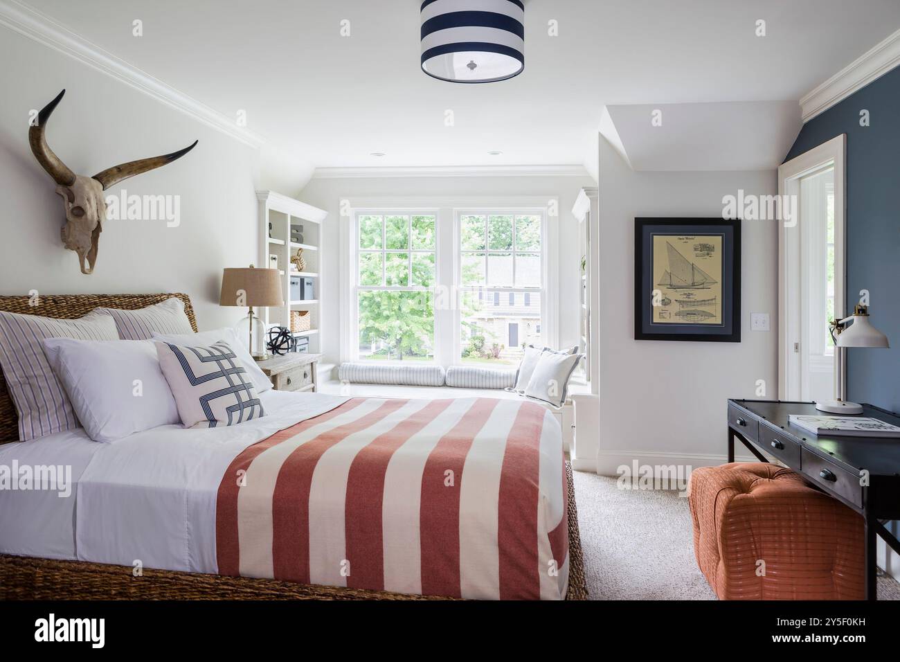Boy's bedroom with interesting artwork and window seat Stock Photo - Alamy