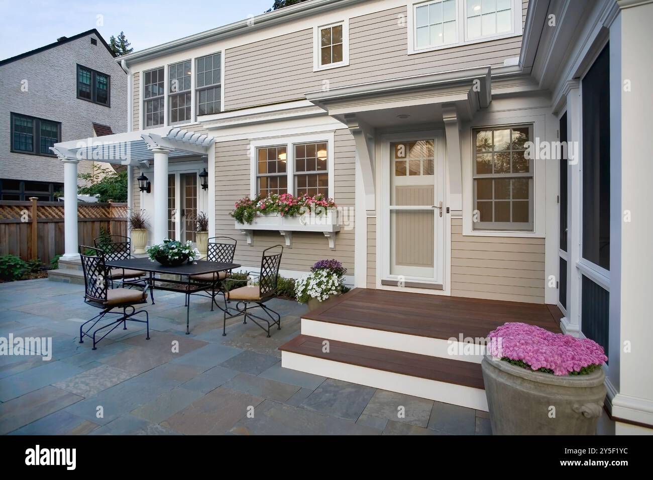 Back exterior of wood house showing back door and screened porch and ...