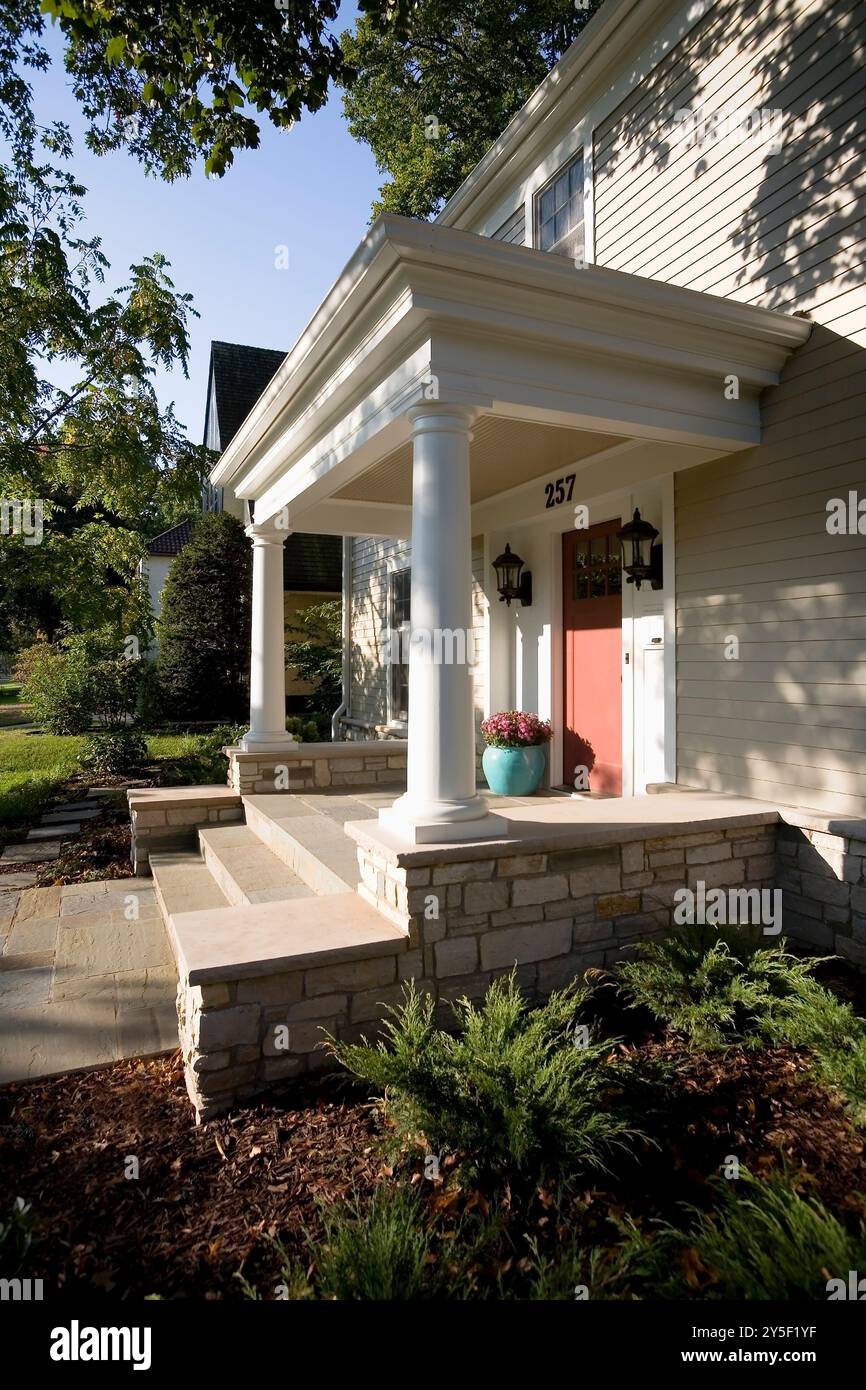 Grand entrance to house showing front door and large overhang with ...