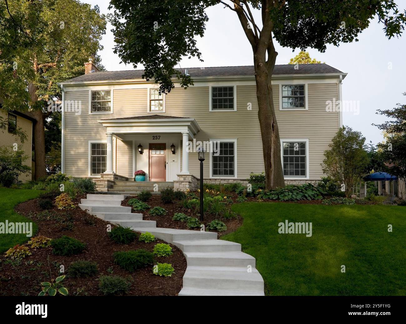 Long winding cement steps lead up to front door hi-res stock ...