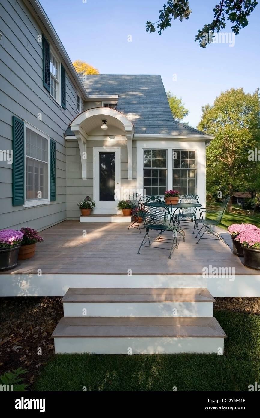 Back exterior of remodeled house showing addition and deck from ...