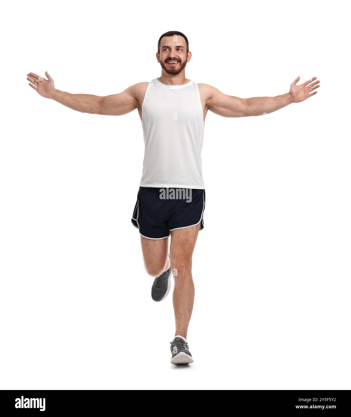 Handsome young man running on white background Stock Photo - Alamy