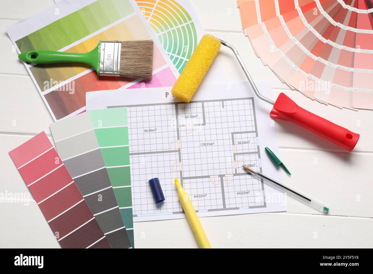 Designer's workplace with color palettes, floor plan and different ...