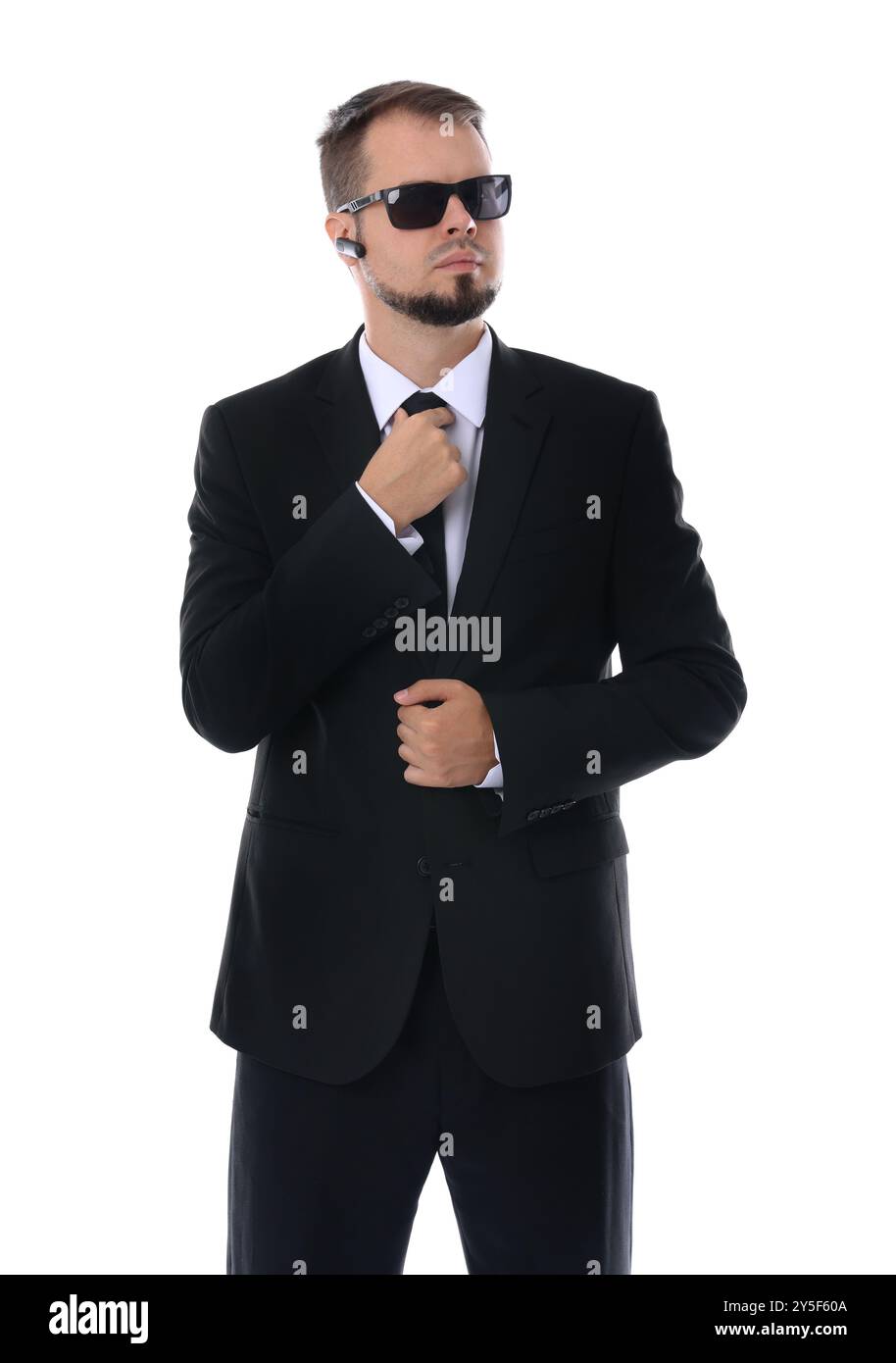 Young bodyguard in suit and sunglasses isolated on white Stock Photo ...