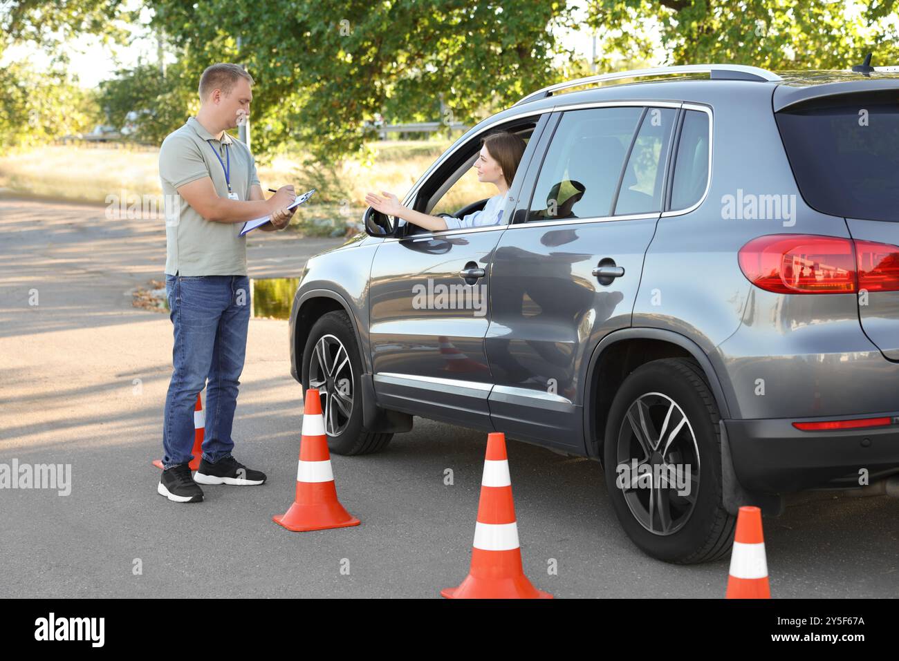 Woman passing maneuverability driving test on track Stock Photo - Alamy
