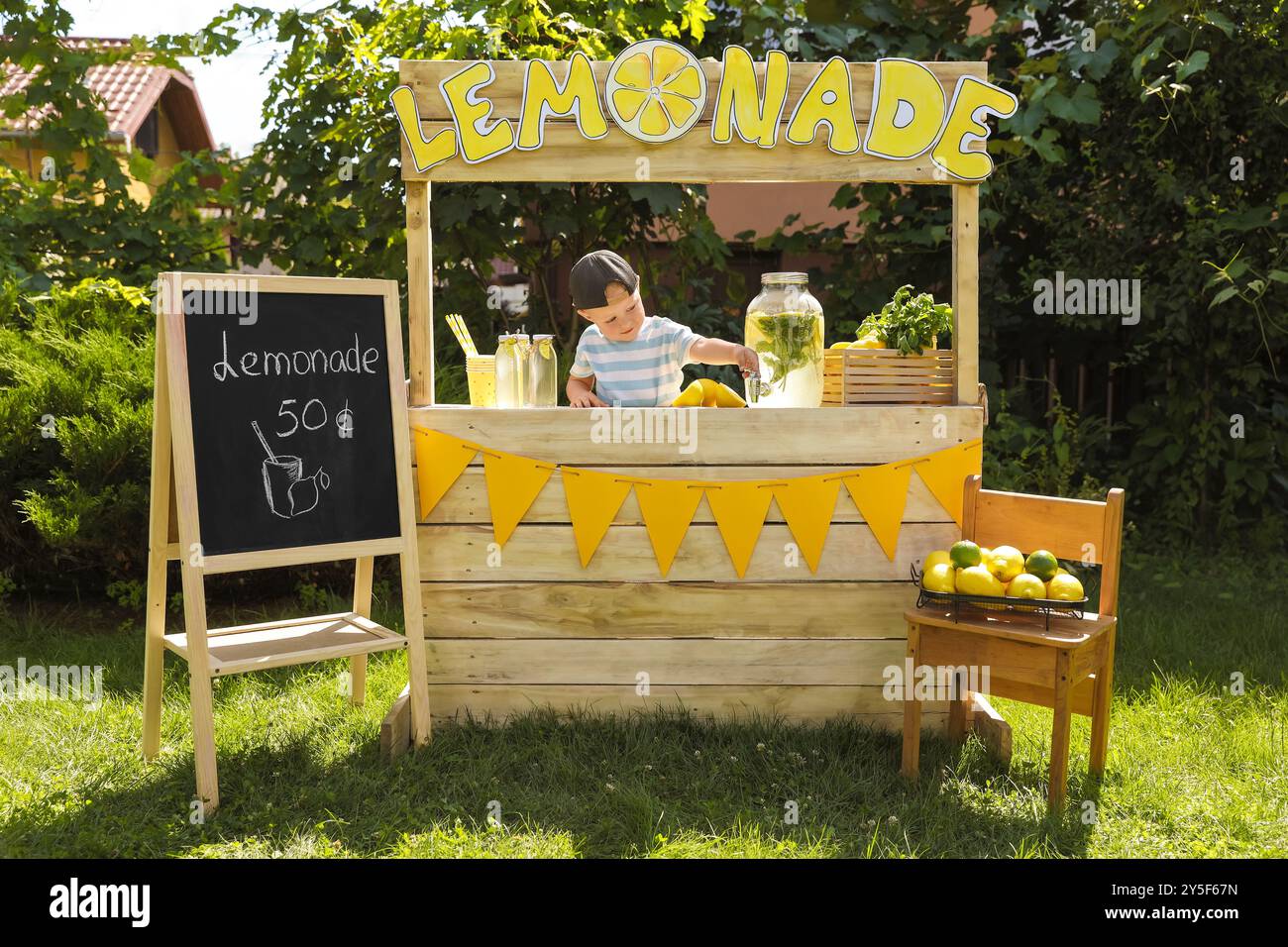 Cute little boy at lemonade stand in park Stock Photo - Alamy