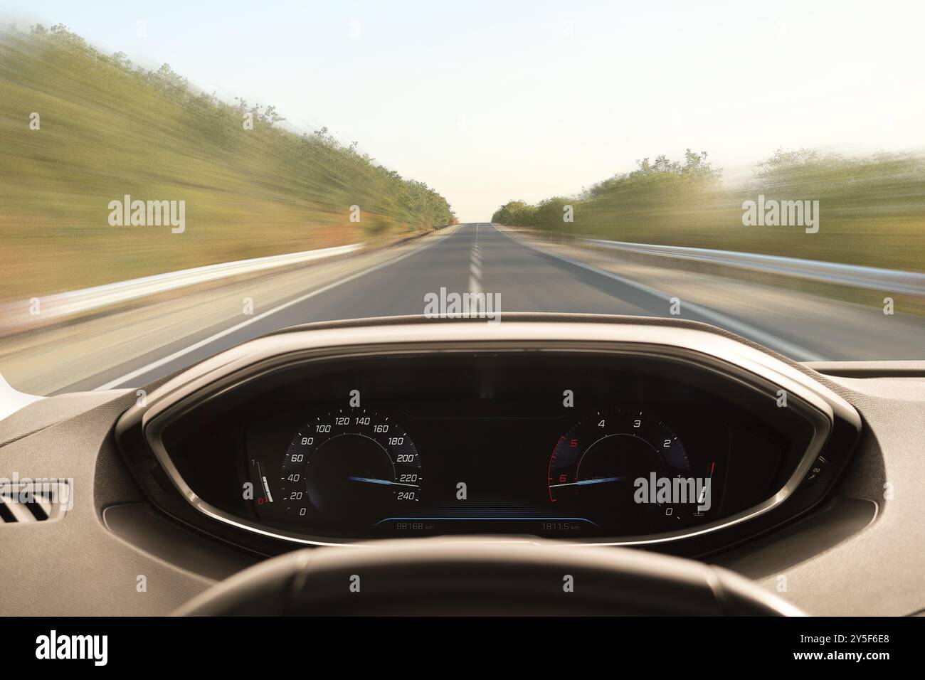 Car driving on empty road at high speed, view from driver's seat ...