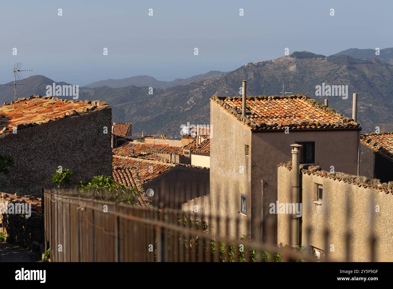 Rustic village rooftops with mountain and coastal views Stock Photo - Alamy
