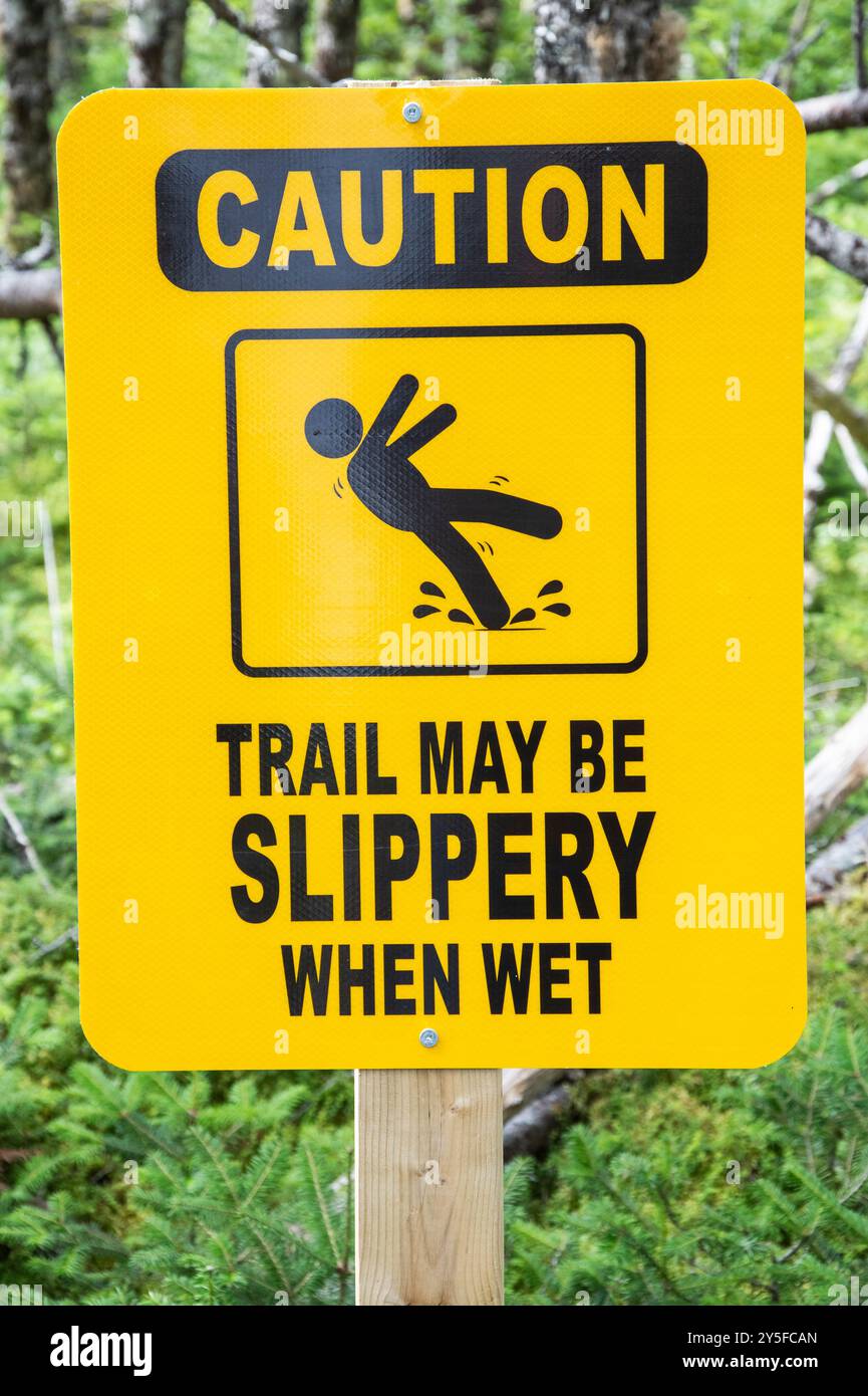 Caution sign trail slippery when wet at Salmonier Nature Park on NL 90 ...