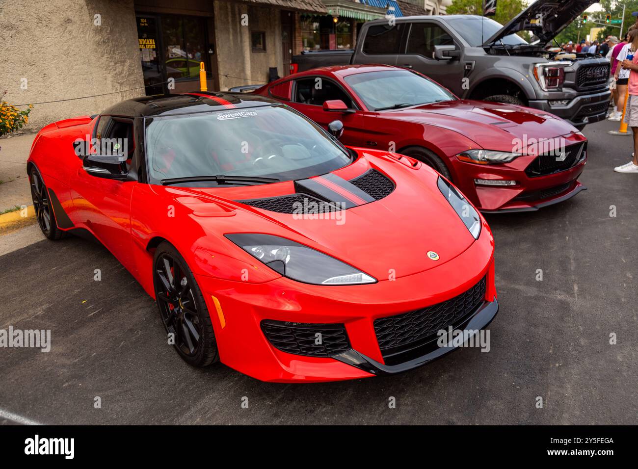 An orange Lotus Evora GT sports car on display at a car show in Auburn ...