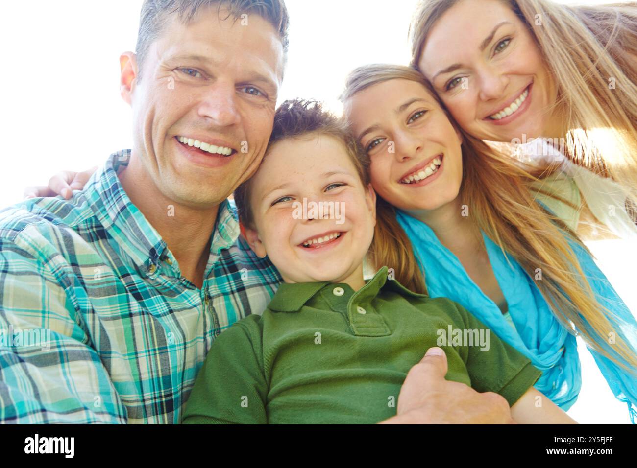 Portrait, outdoor and parents with siblings, hug and bonding together ...