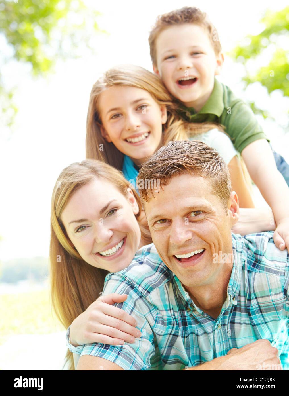 Portrait, happy family pyramid and parents with kids at park for ...