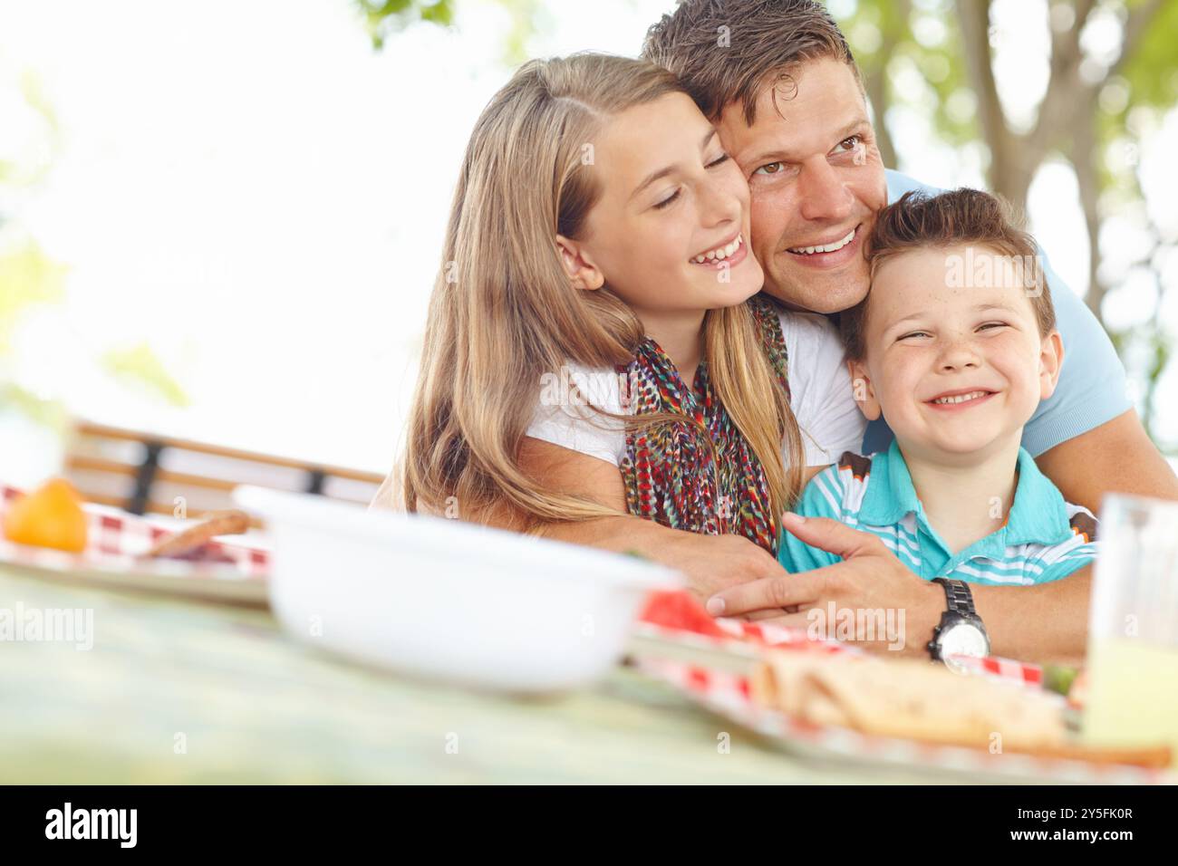 Father, kids and happy at park on picnic for fun, support and care ...