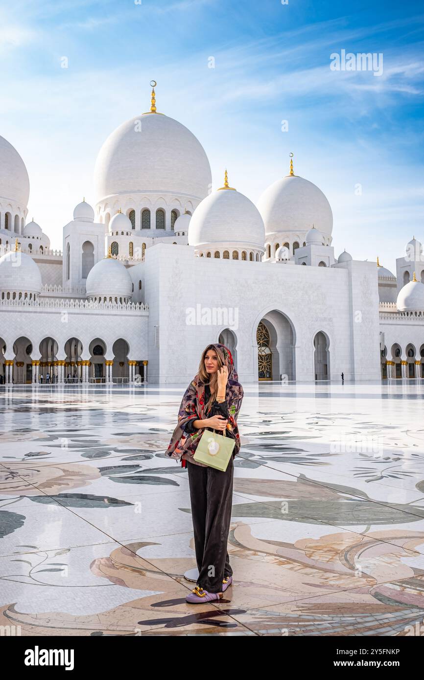 Woman tourist wearing a hijab in the courtyard of Sheikh Zayed Grand ...