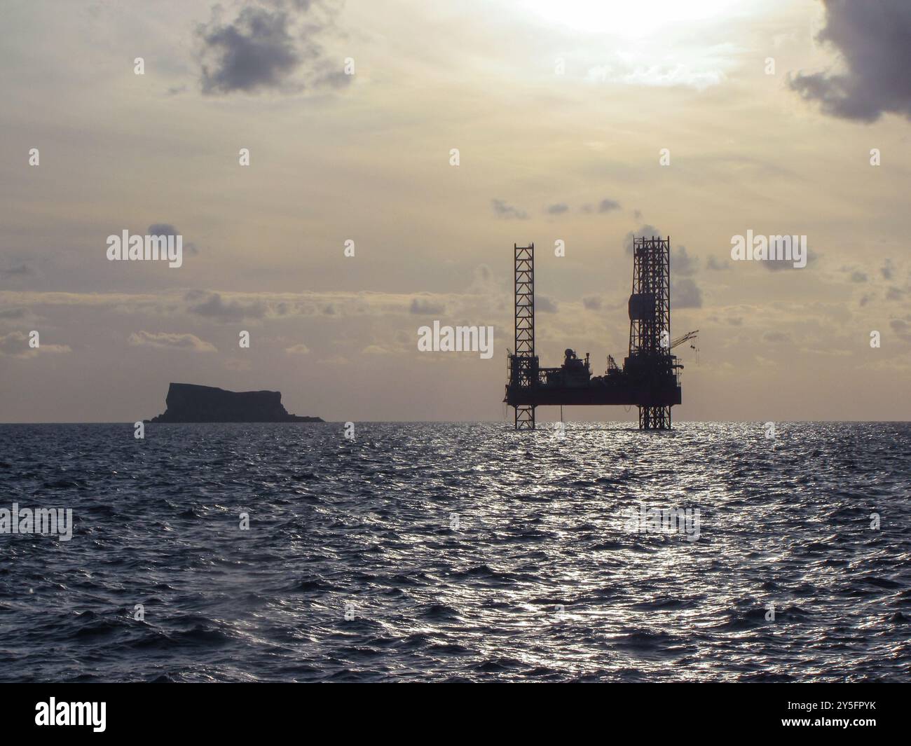 oil rig at sunset Stock Photo - Alamy