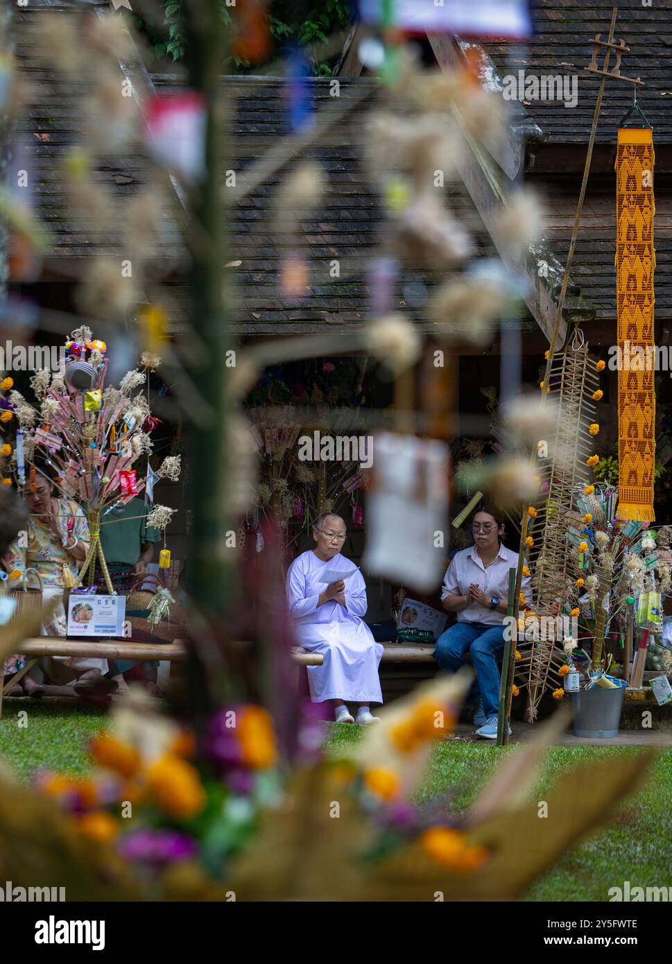 Chiang Mai, Thailand. 21st Sep, 2024. A nun is chanting prayers during ...