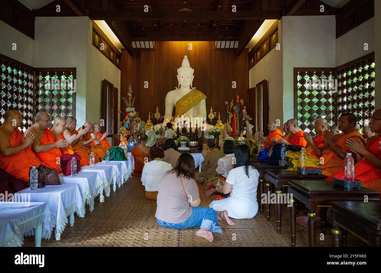 Chiang Mai, Thailand. 21st Sep, 2024. Monks and devotees are praying ...