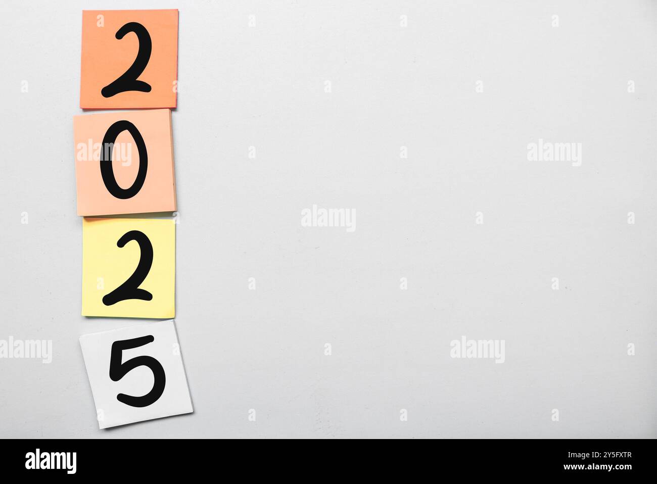 New year's resolutions 2025 on the sticky note isolated gray background ...