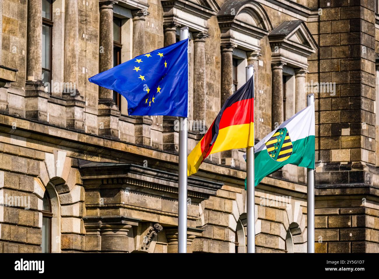 The European, German and Saxon flags fly in front of the Saxon State ...