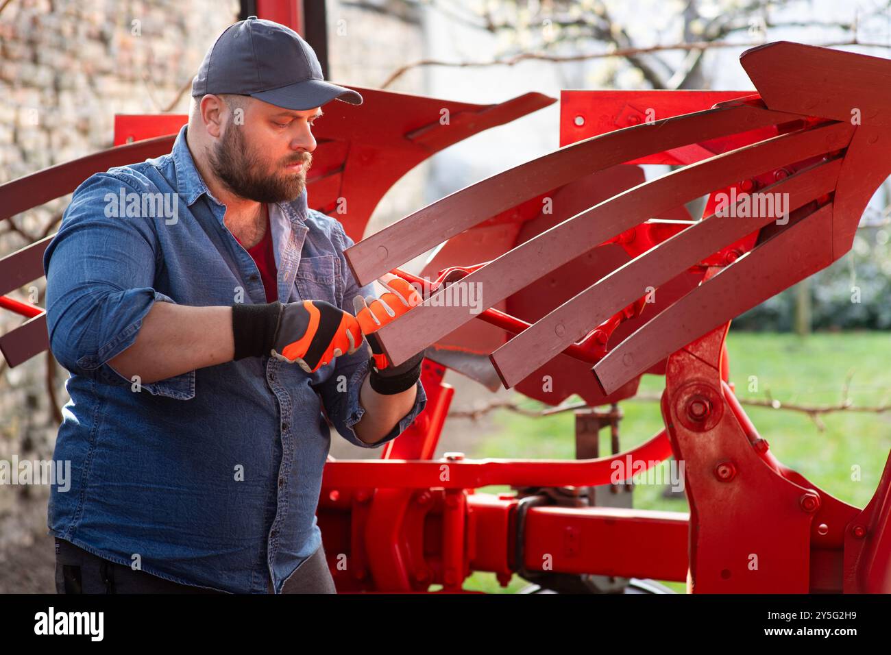 Farmer repairs agricultural machines hi-res stock photography and ...