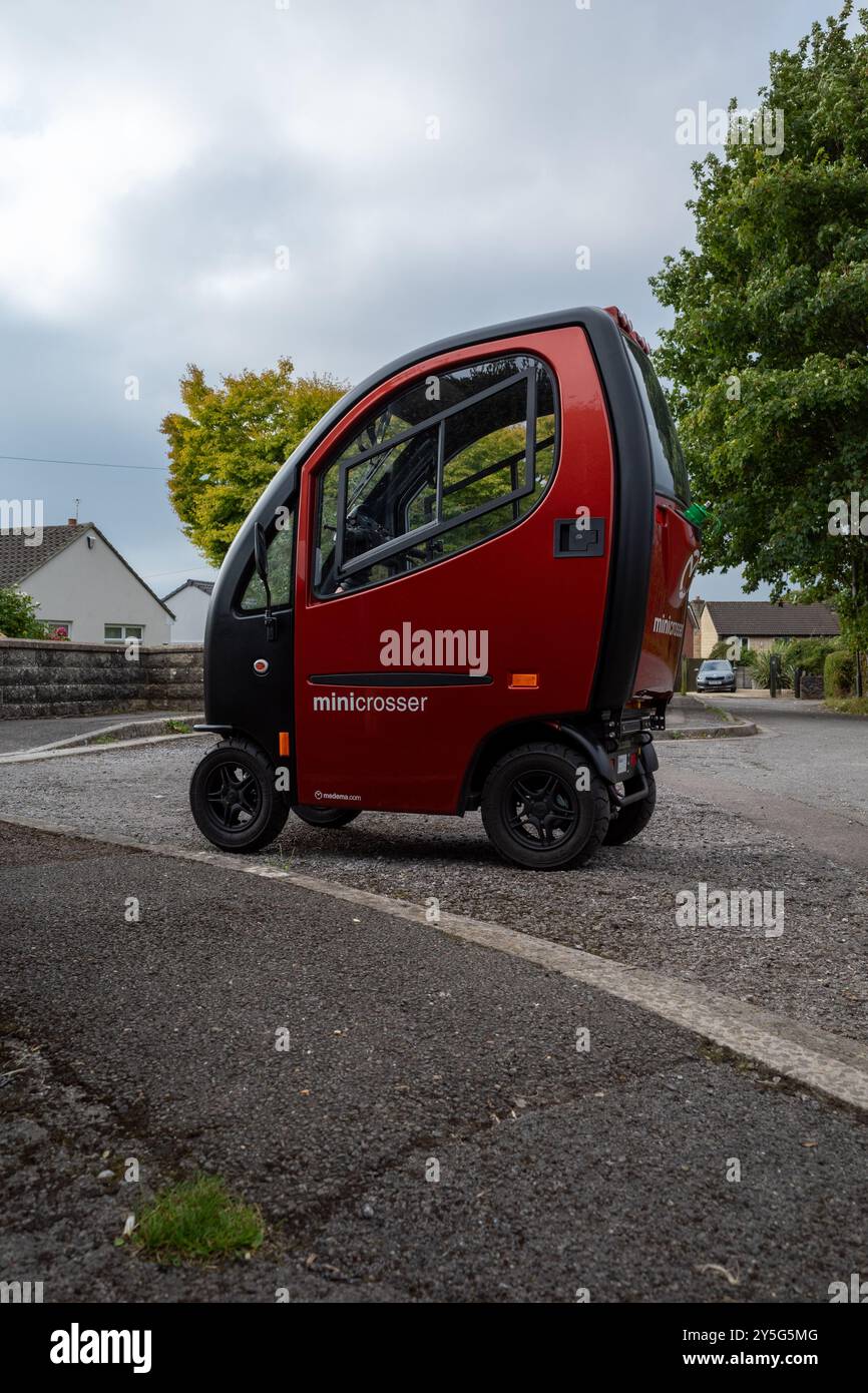 Red Mini Crosser X2 Cabin Mobility Scooter Stock Photo - Alamy