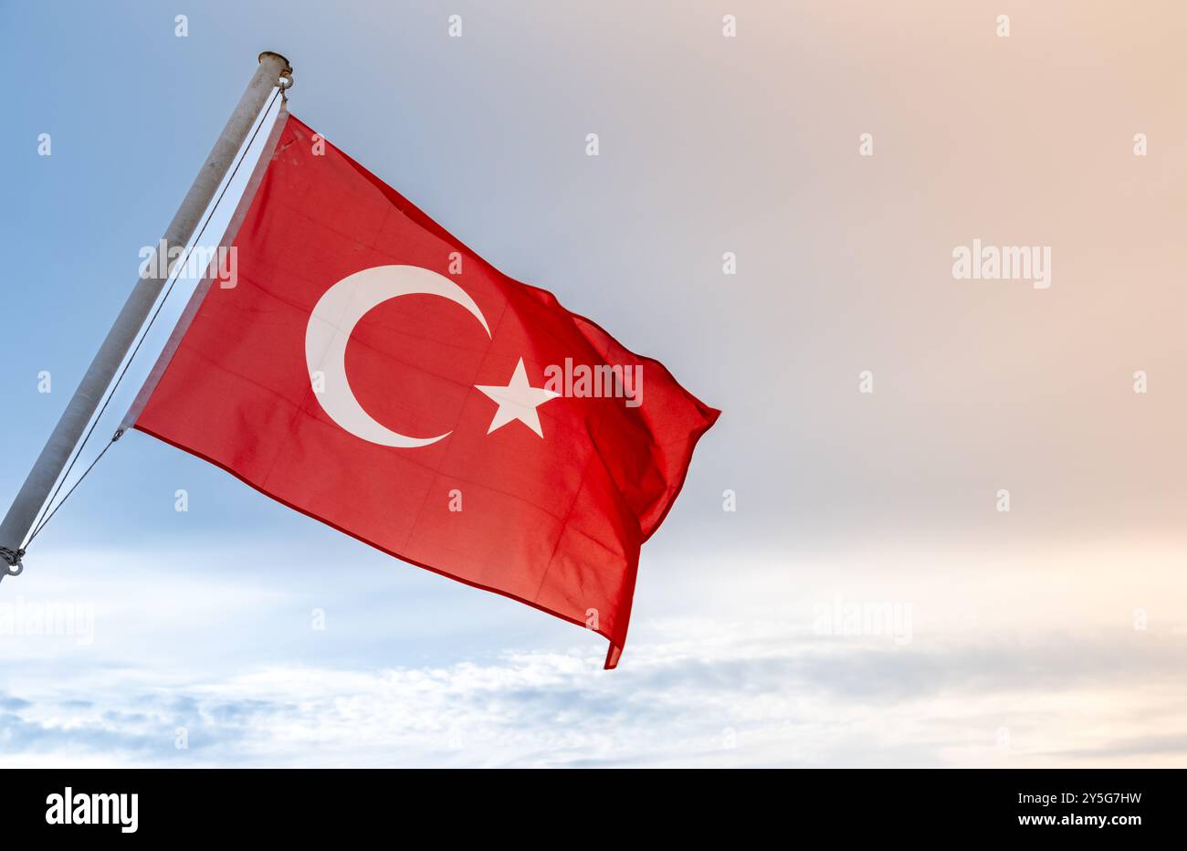 Turkish flag waving against a bright sky, symbolizing national pride ...