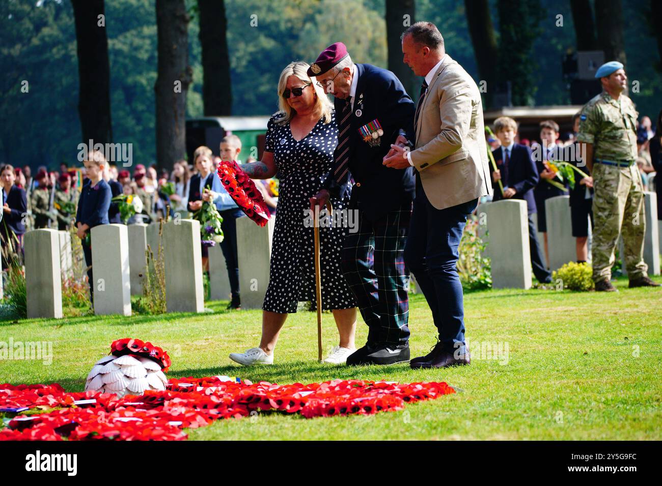 Veteran Geoff Roberts (centre) lays a wreath during a ceremony at the ...