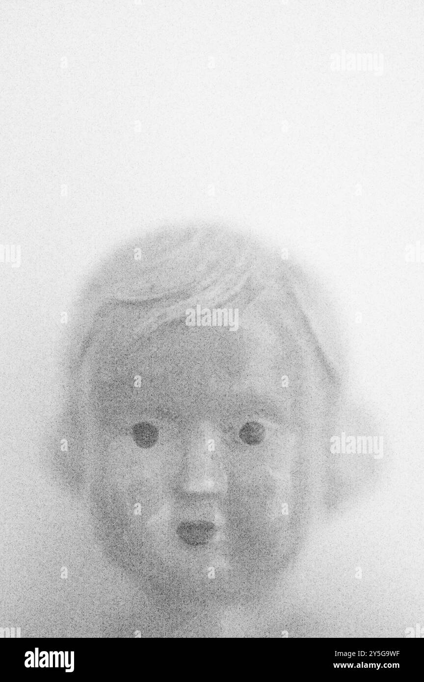 Soft and pencil likle black and white image of face of 1930s girl doll ...