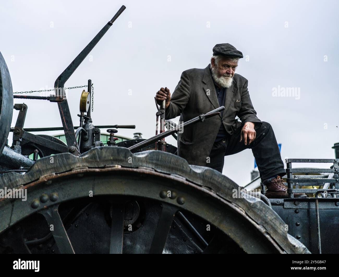 PORTRAIT OF STEAM ENGINE OWNER STANDING ON HIS STEAM ENGINE SAINT ...