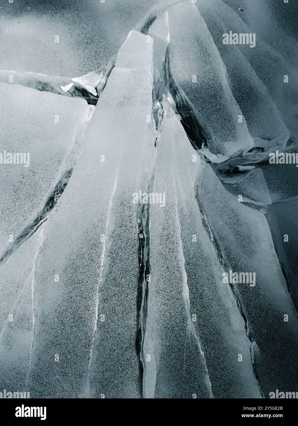 Abstract ice texture. Blue cold background with cracks on the frosty ...