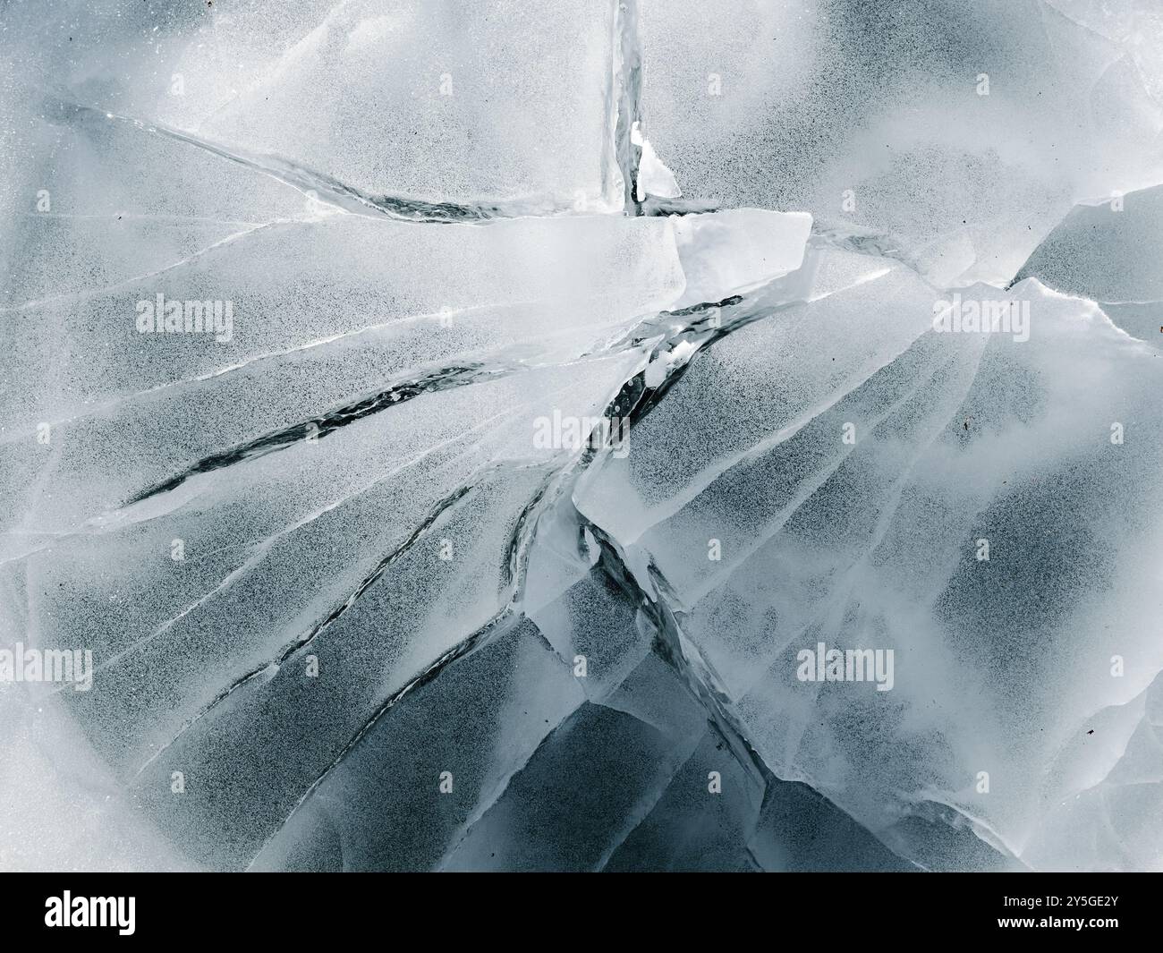 Abstract ice texture. Blue cold background with cracks on the frosty ...
