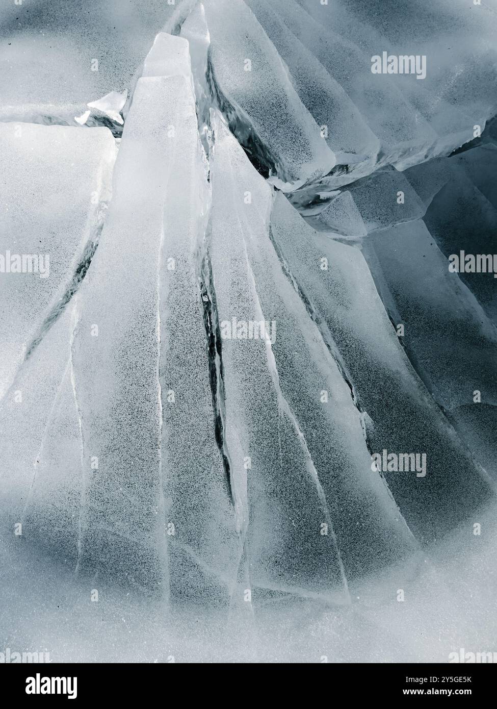 Abstract ice texture. Blue cold background with cracks on the frosty ...
