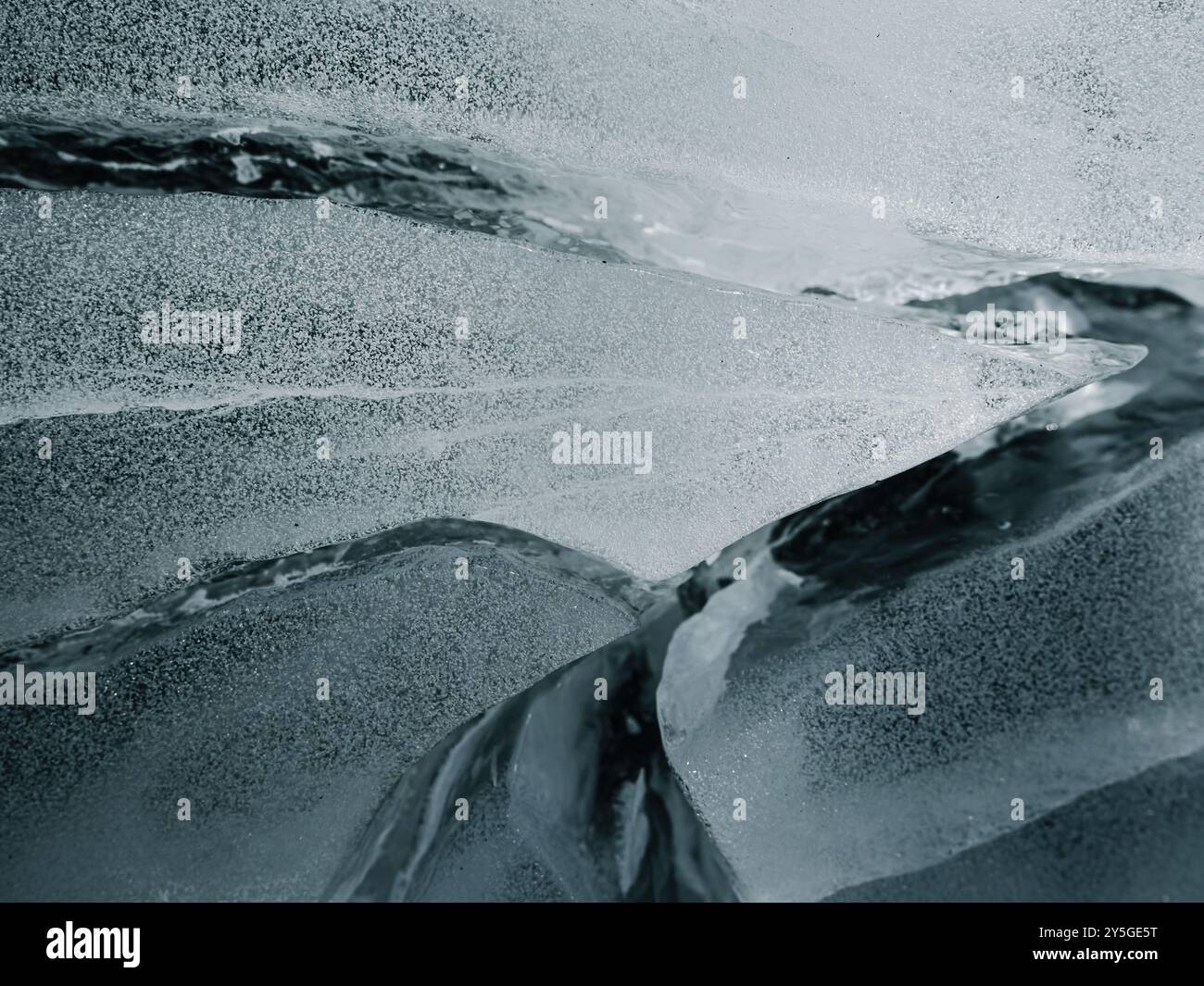 Abstract ice texture. Blue cold background with cracks on the frosty ...