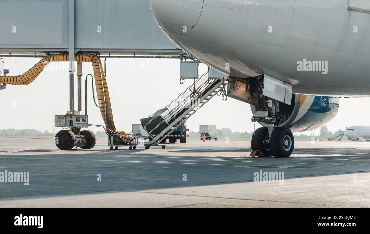 Widebody jet being prepared for a flight. Low angle view of commercial ...