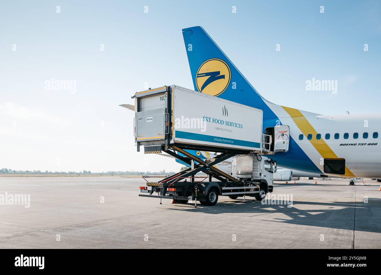 Catering truck near Boeing 737. Ukraine International Airlines plane ...