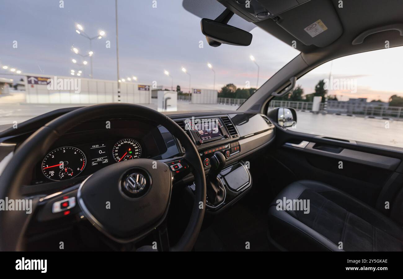 Interior of Volkswagen Transporter at dusk. Front row of seats and ...