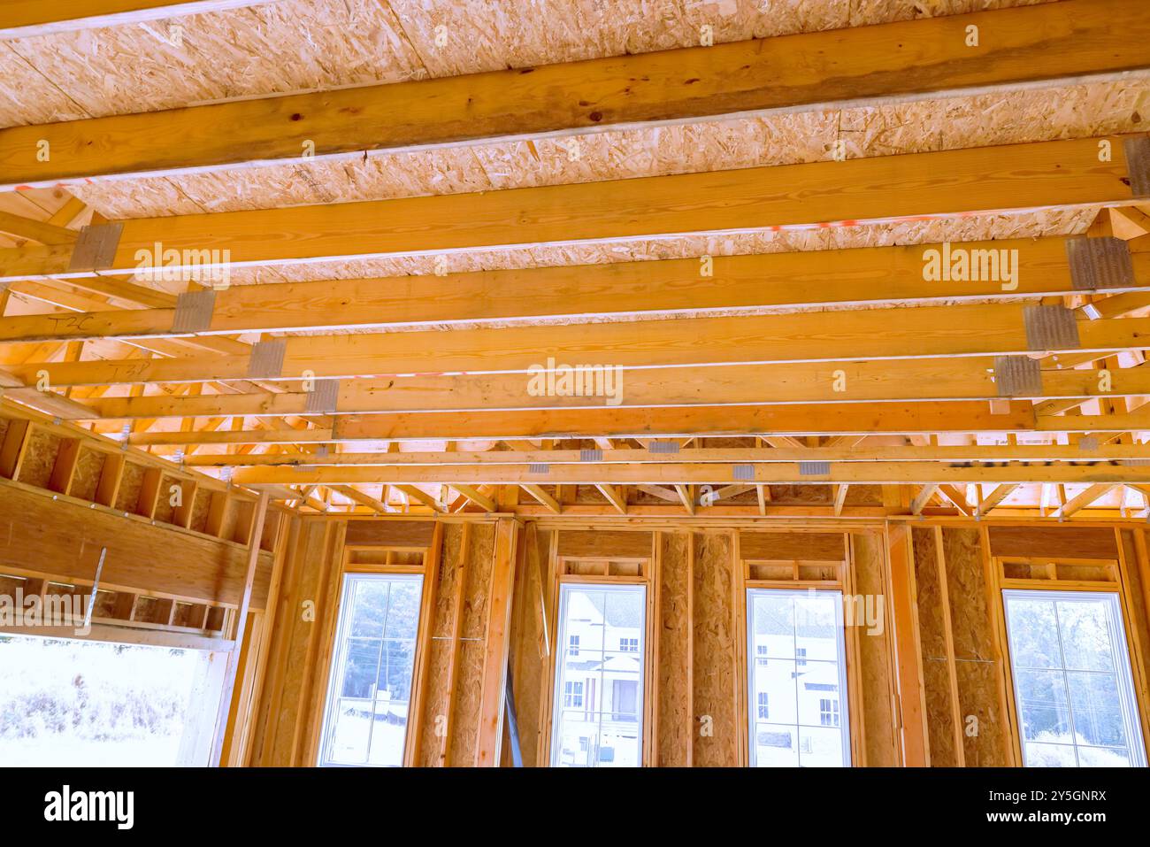 Interior of newly constructed house with wooden stud timber framing ...