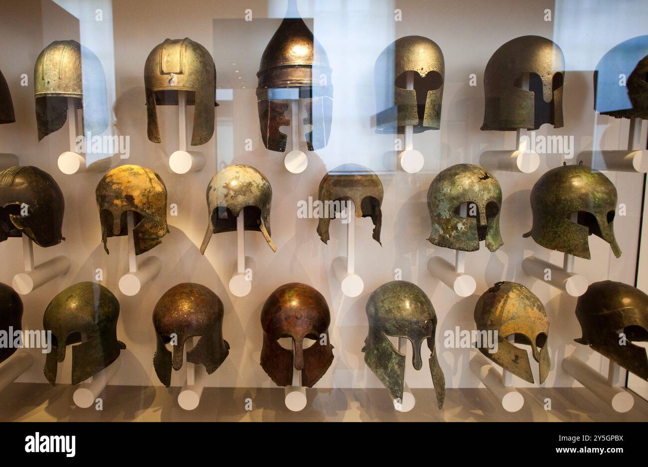 Berlin, Germany, July 24 2009, Ancient Greek helmets are showcased in a ...