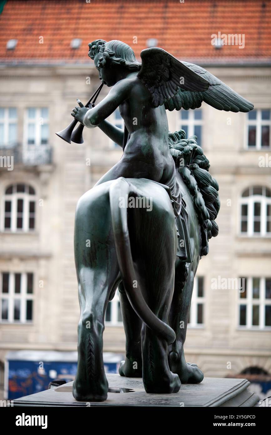 A detailed view of a bronze angel on a lion statue located in ...