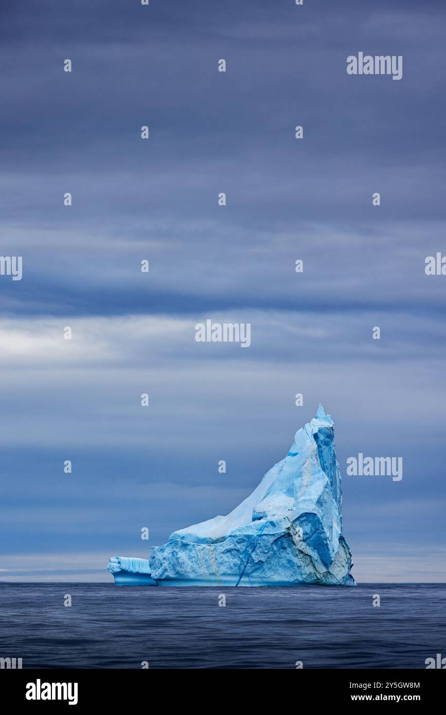 Blue iceberg in the cold, blue waters of the Arctic Ocean at Bontekoe ...