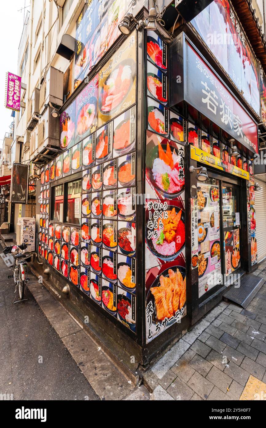 Corner building housing a seafood restaurant with the entire walls on ...