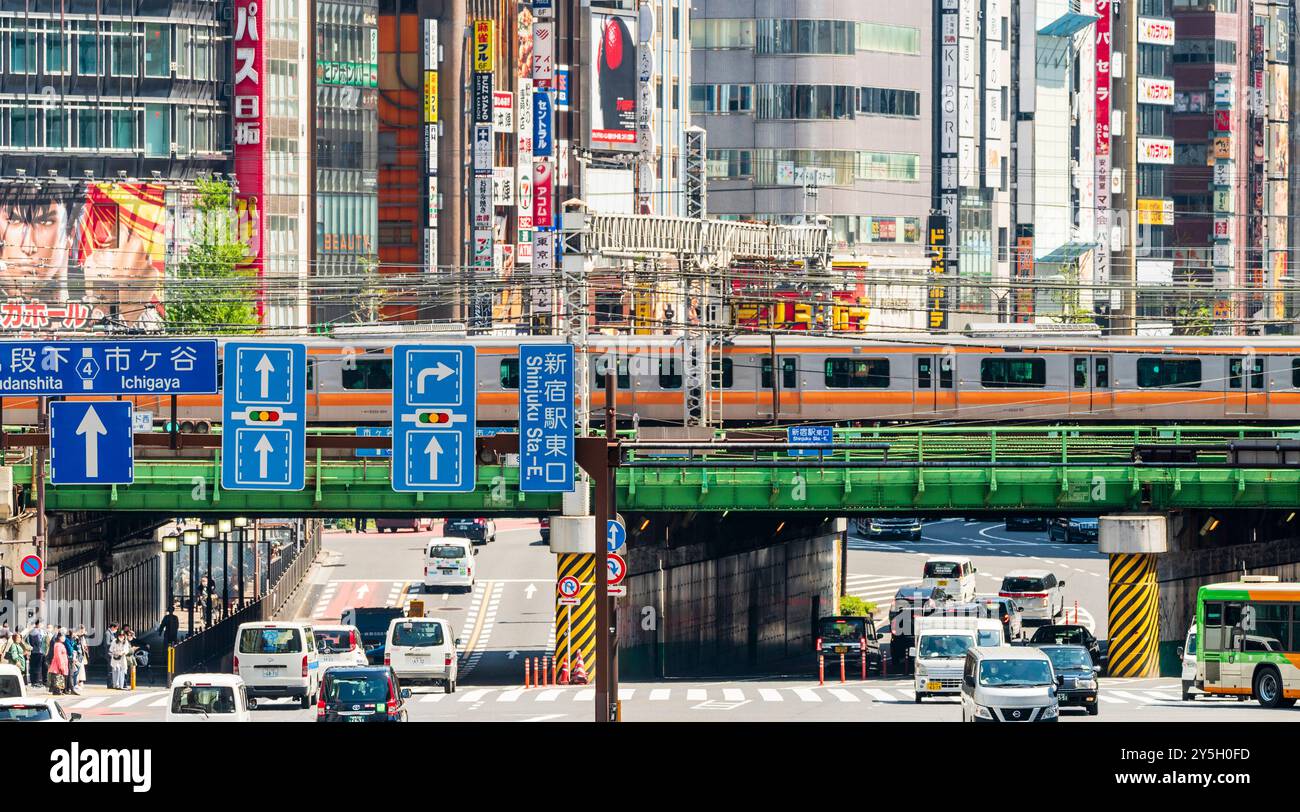 Famous Shinjuku viewpoint. Railway bridge over Ome-Kaido Avenue with a ...