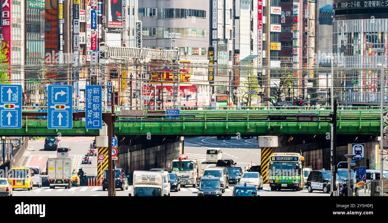 Famous Shinjuku viewpoint. Railway bridge over Ome-Kaido Avenue with a ...